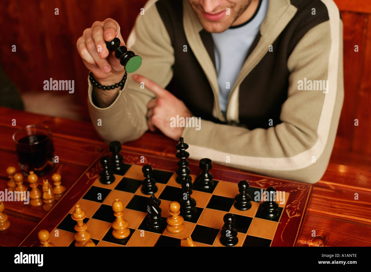 Man making chess move Stock Photo - Alamy