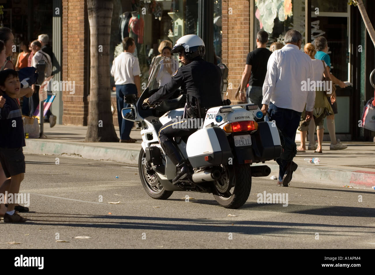 California Highway Patrol officer riding a motorcycle at the Doo-Dah ...