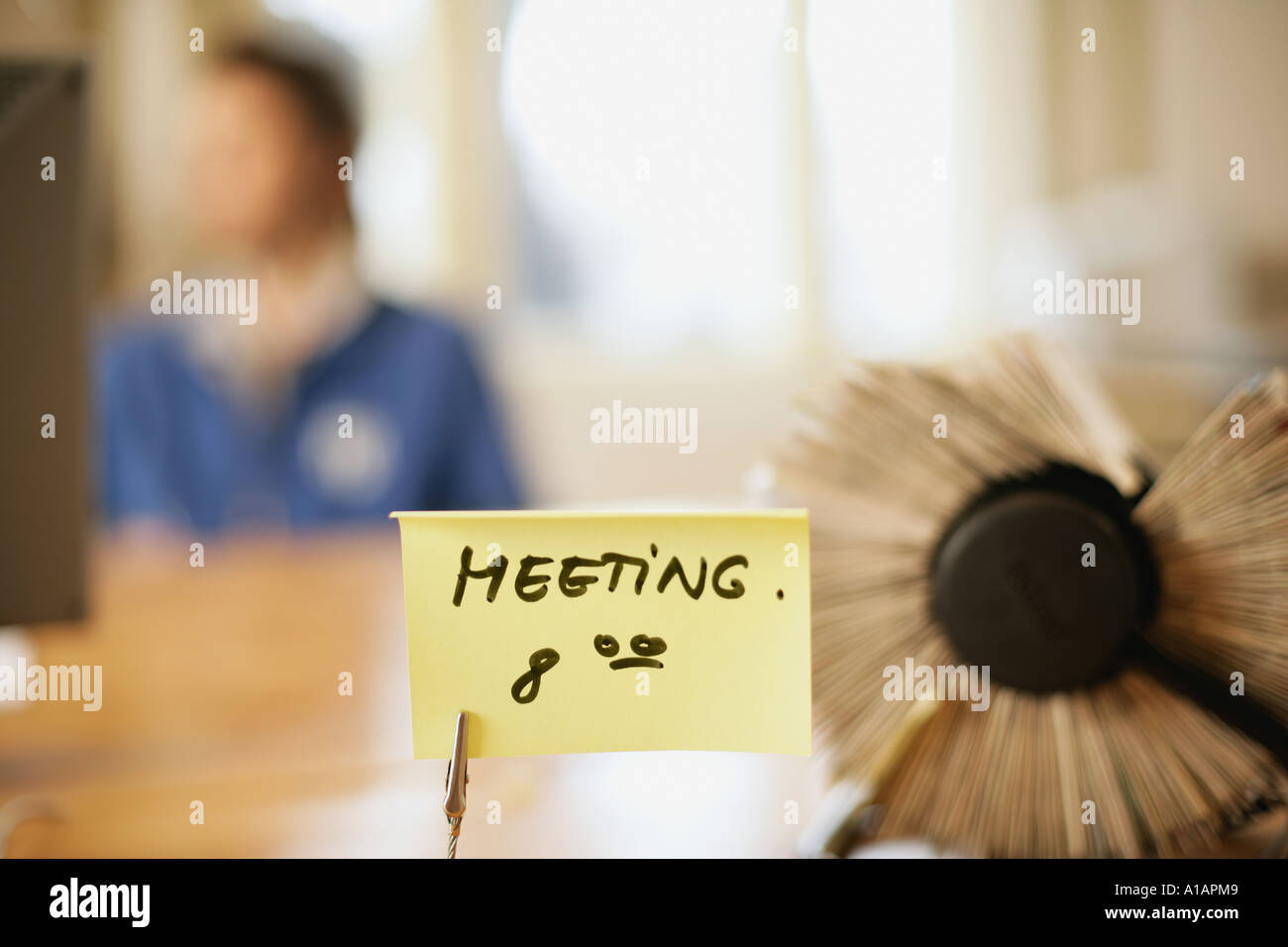 Note and rotary card file on man's desk Stock Photo - Alamy