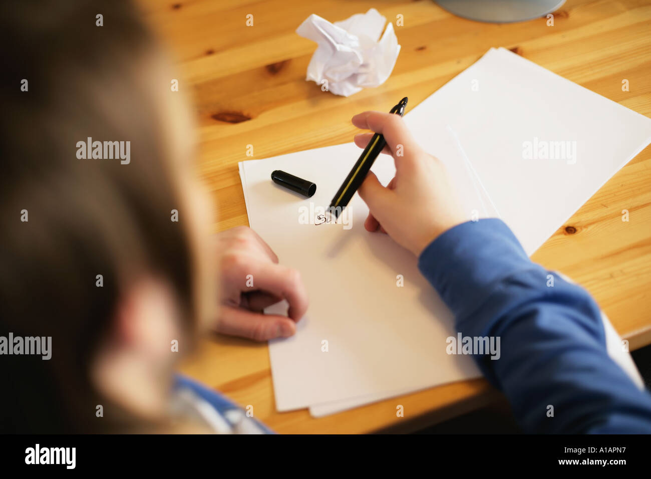 Man writing at his desk Stock Photo - Alamy