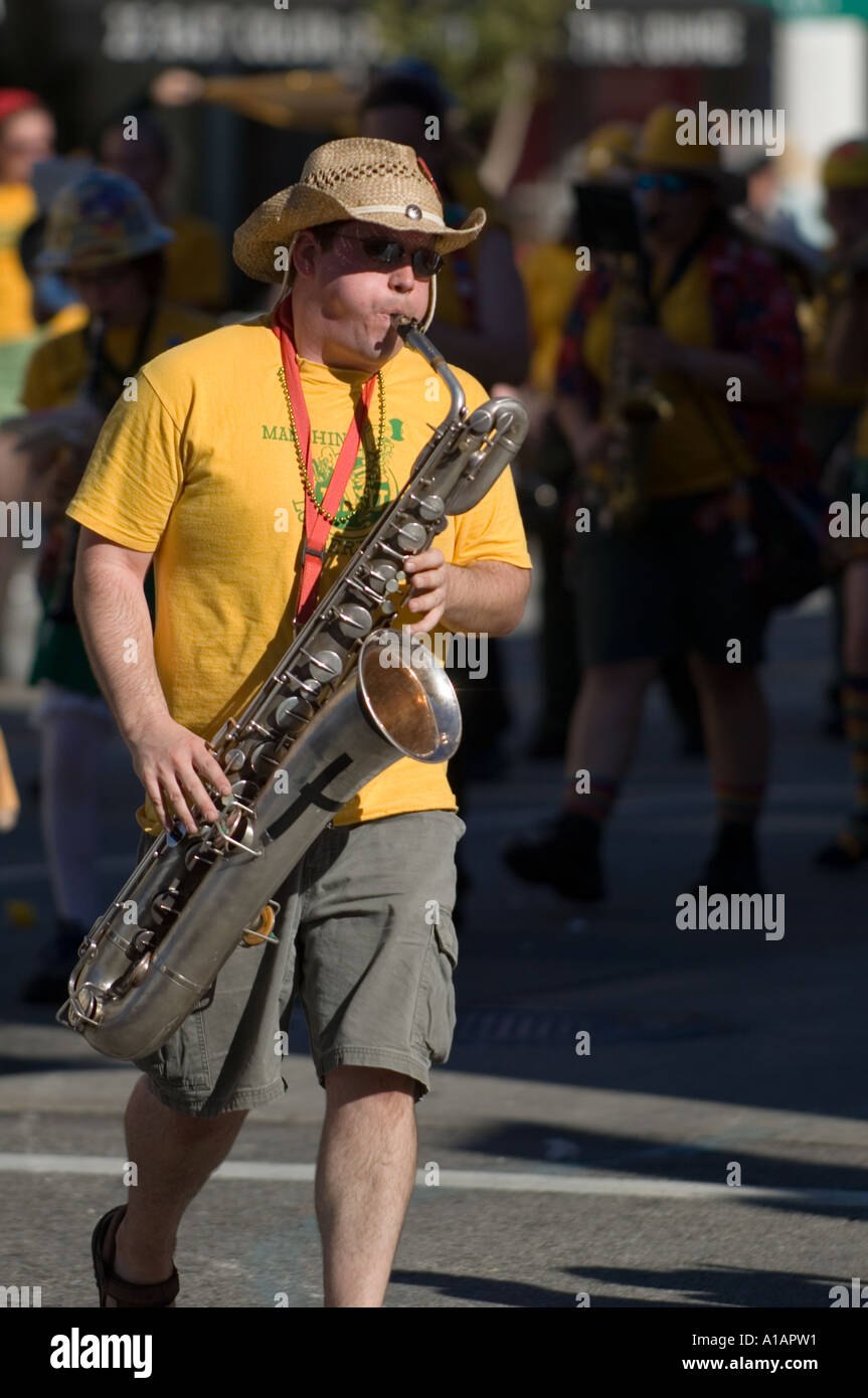 Man marching while playing saxo at the Doo-Dah Parade in Pasadena ...