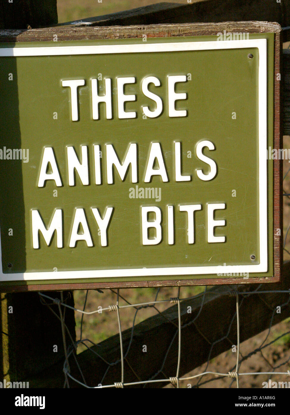 A warning sign that these animals may bite Stock Photo - Alamy