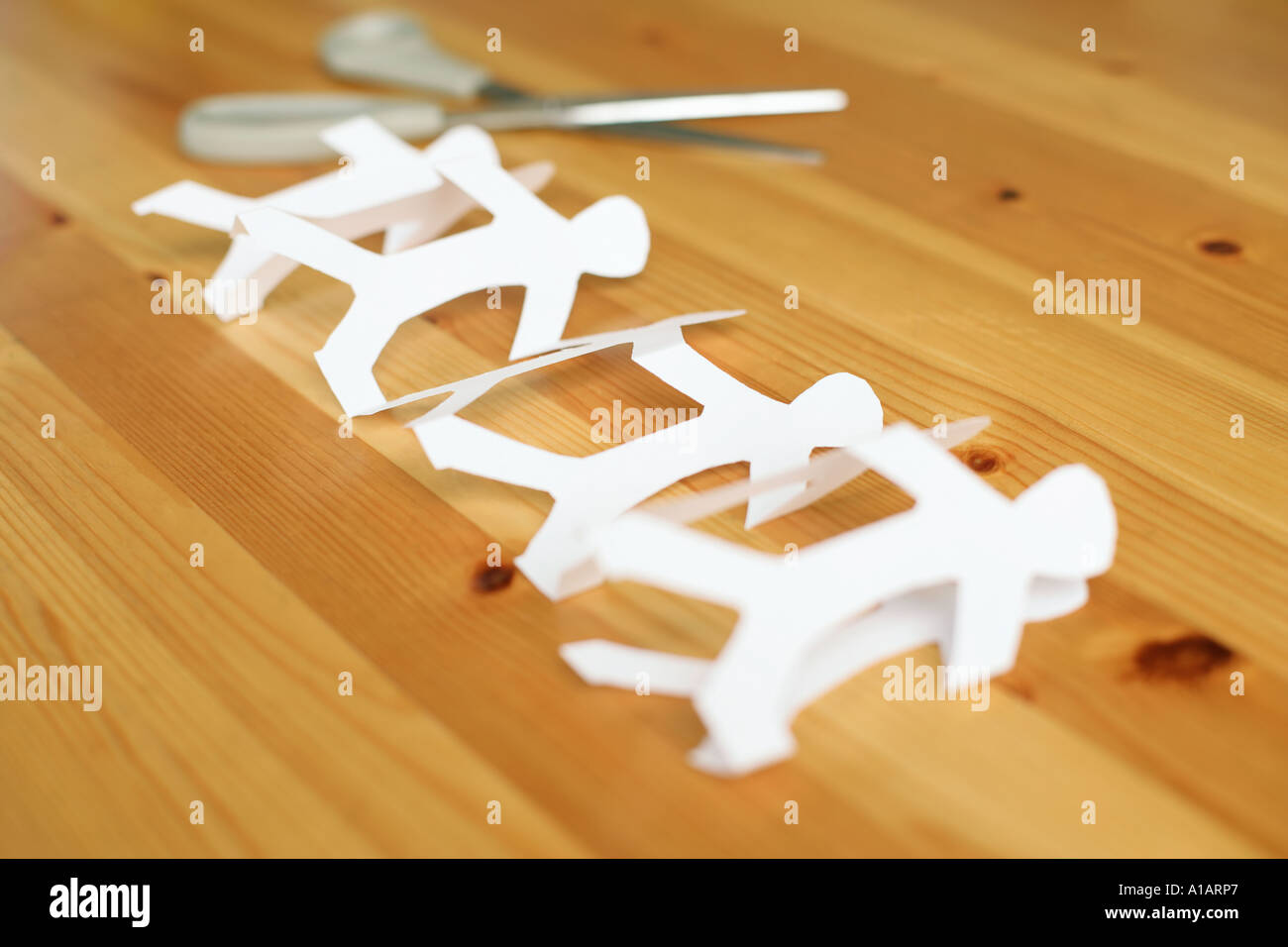 Paper chain on a table Stock Photo - Alamy