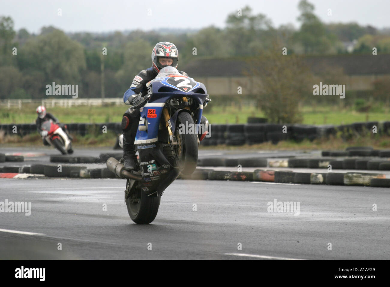 Motorcycle racer Michael Swann does a wheelie on his last ever outing ...