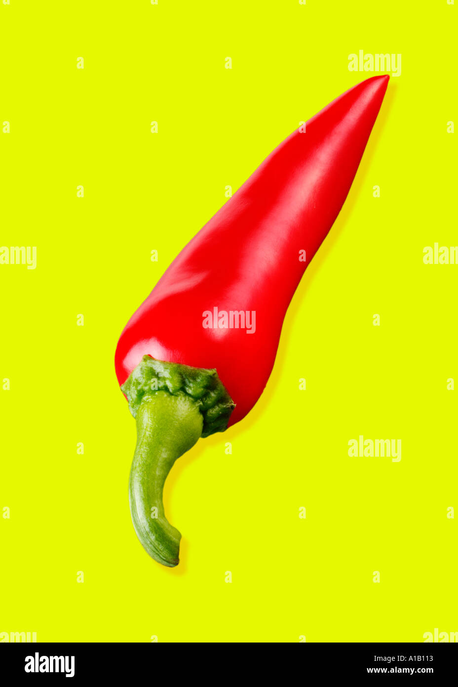 RED CHILLI ON YELLOW Stock Photo - Alamy
