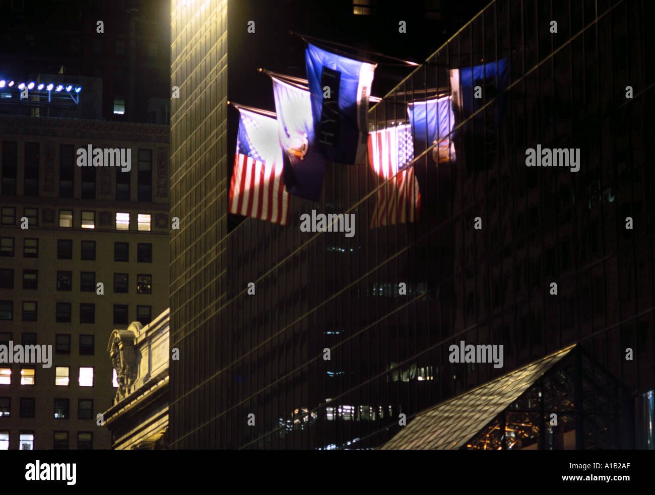Flags flying at night outside New York City Grand Hyatt Hotel USA Stock ...