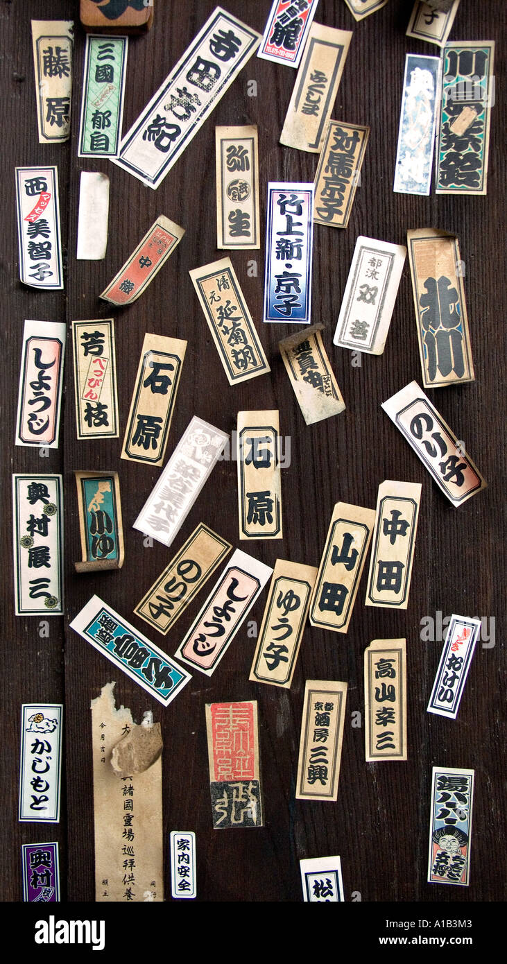 Pilgrims stickers left by visitors at a shrine in Kyoto stuck onto a ...