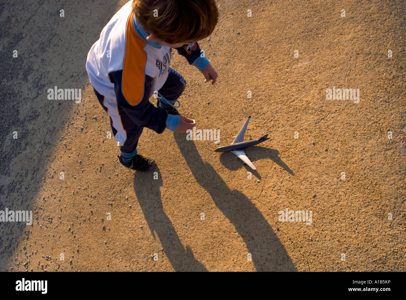 Bending down to pick up hi-res stock photography and images - Alamy