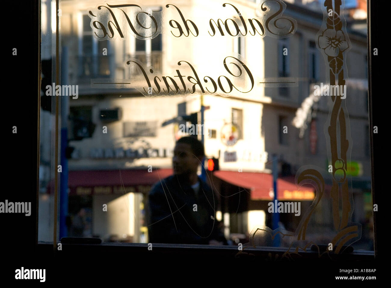 a view through a cafe window onto street in montpellier, france Stock ...