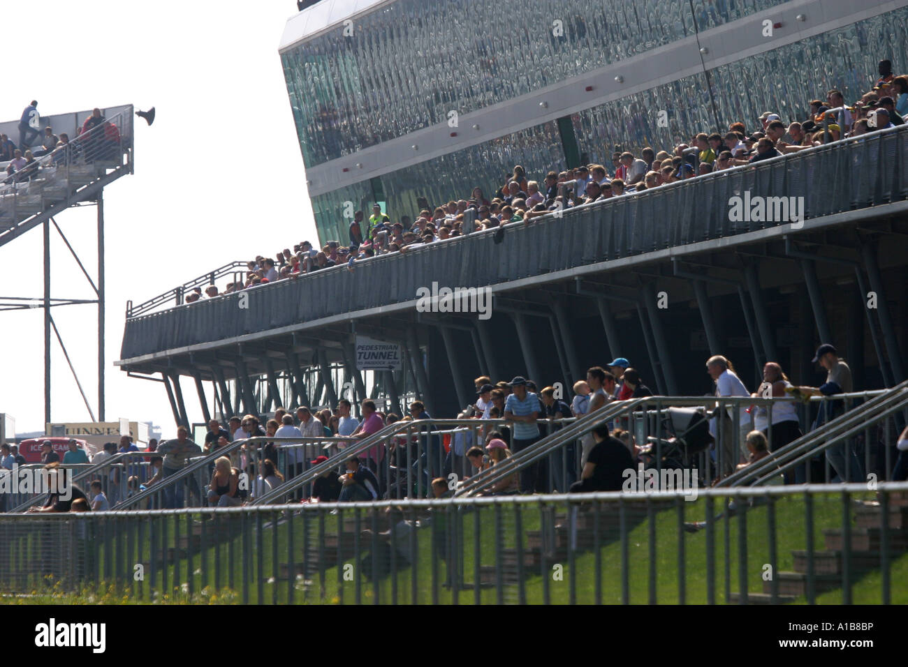 Spectators in grandstand Stock Photo - Alamy