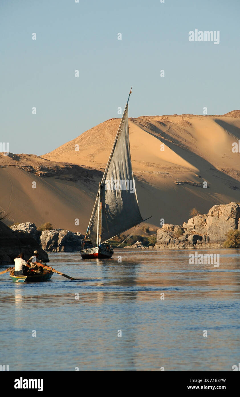 A felucca traditional wooden sailing boat on the Nile river between ...