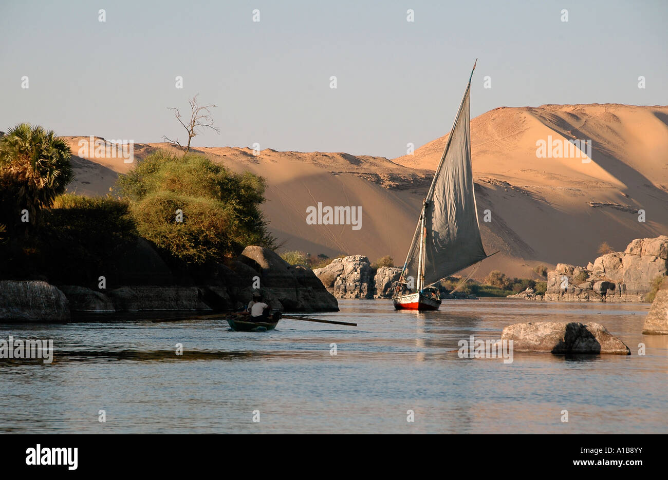 A felucca traditional boat sailing along the Nile river and the First ...