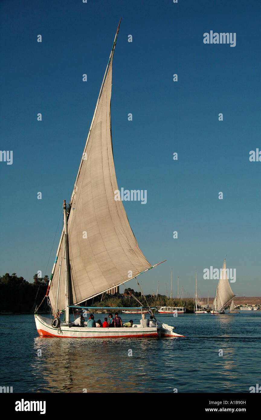 Traditional Felucca boat sailing in the Nile river between Aswan and ...