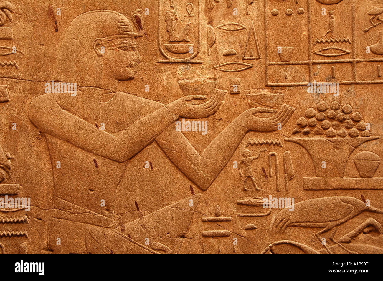 Relief depicts fruits served in the table and a man offering juice at ...