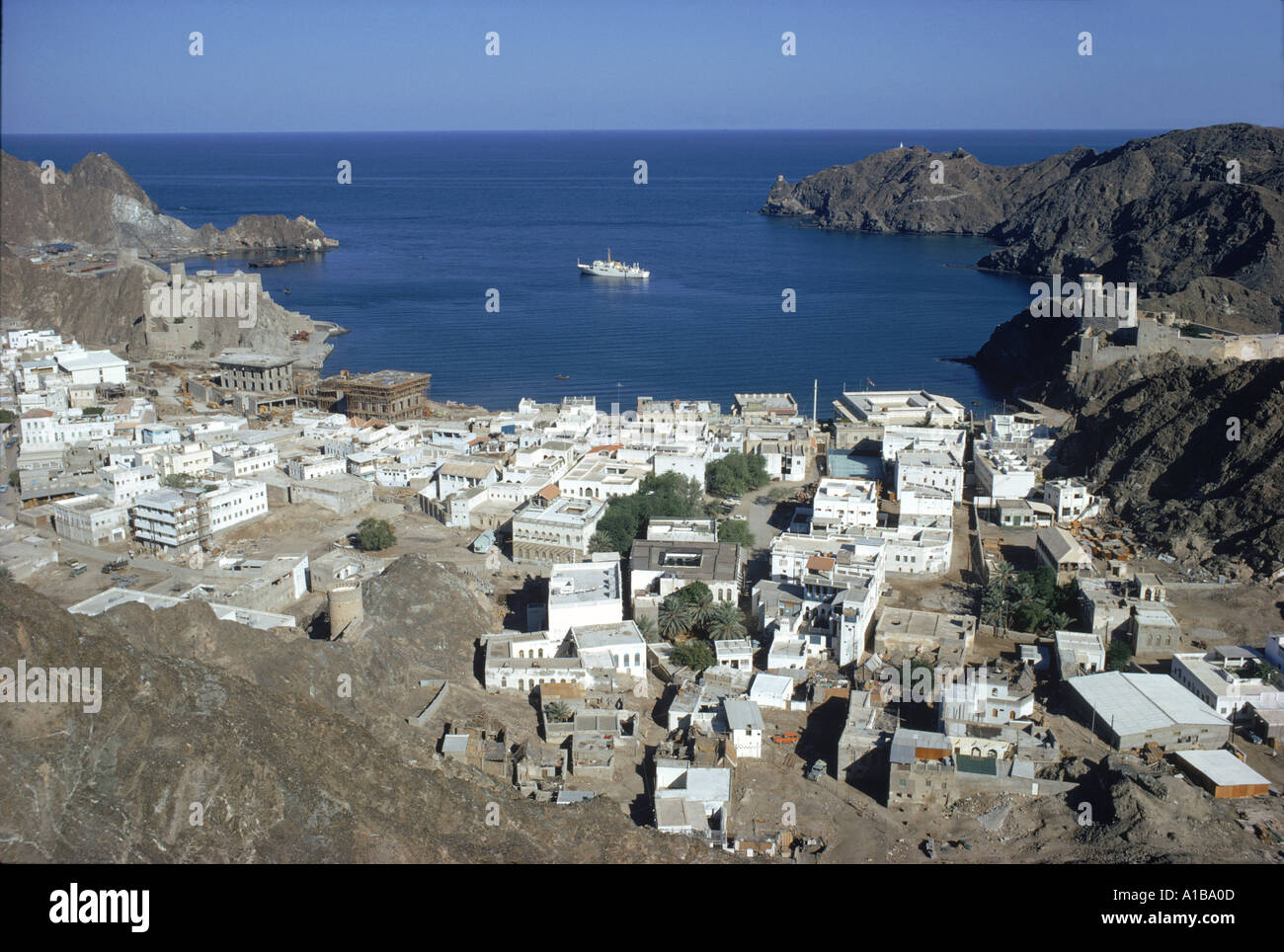 Aerial view over the harbour at Muscat protected by the Merani Fort on ...