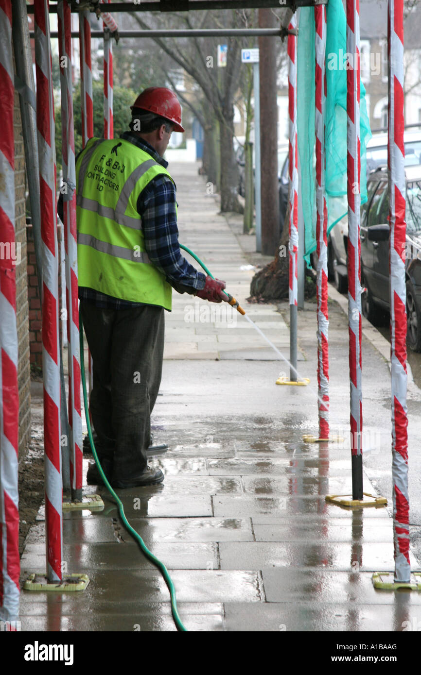 building contractor cleaning pavement Stock Photo - Alamy