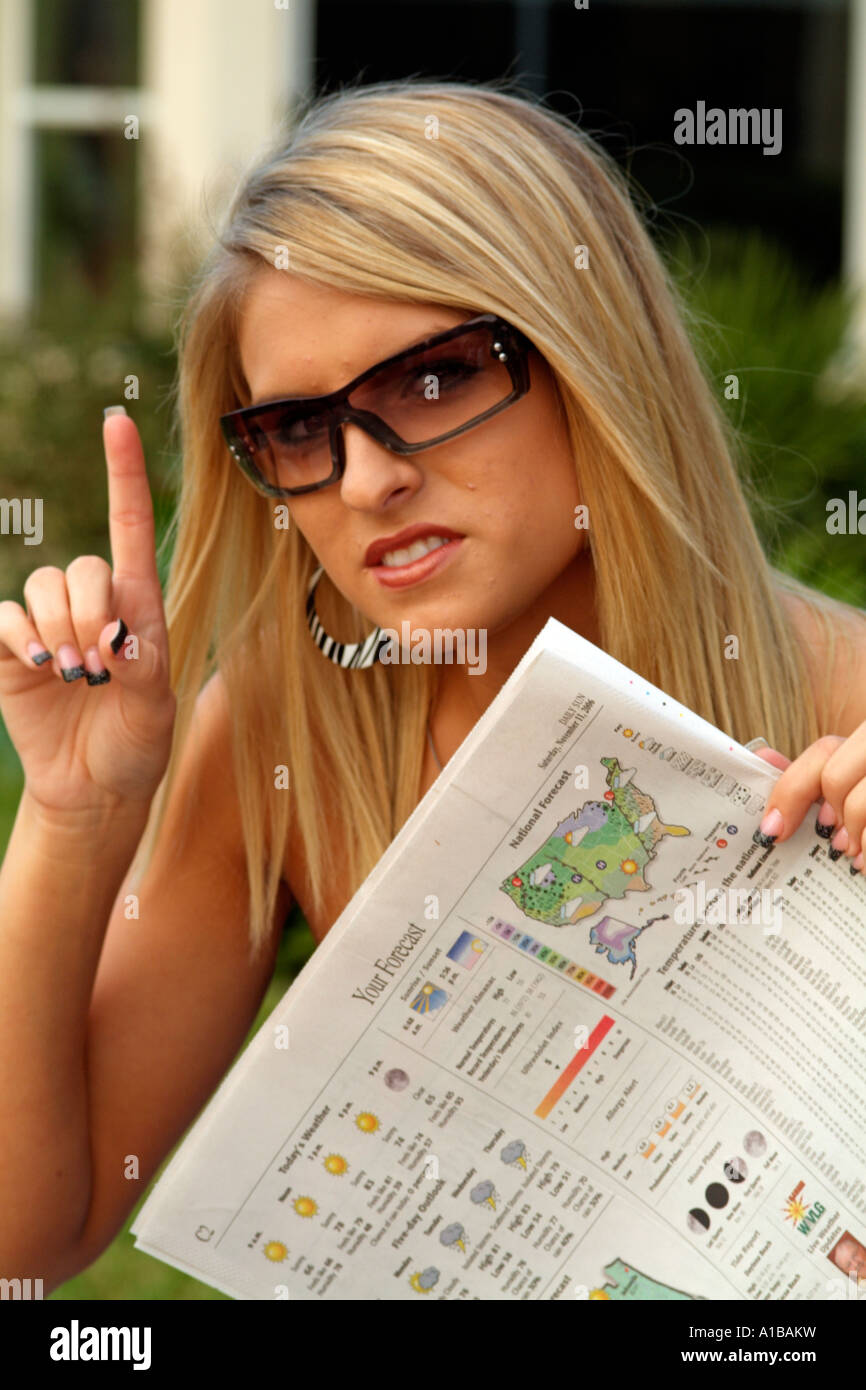 Weather girl. Attractive woman checking the weather forecast. USA Stock ...