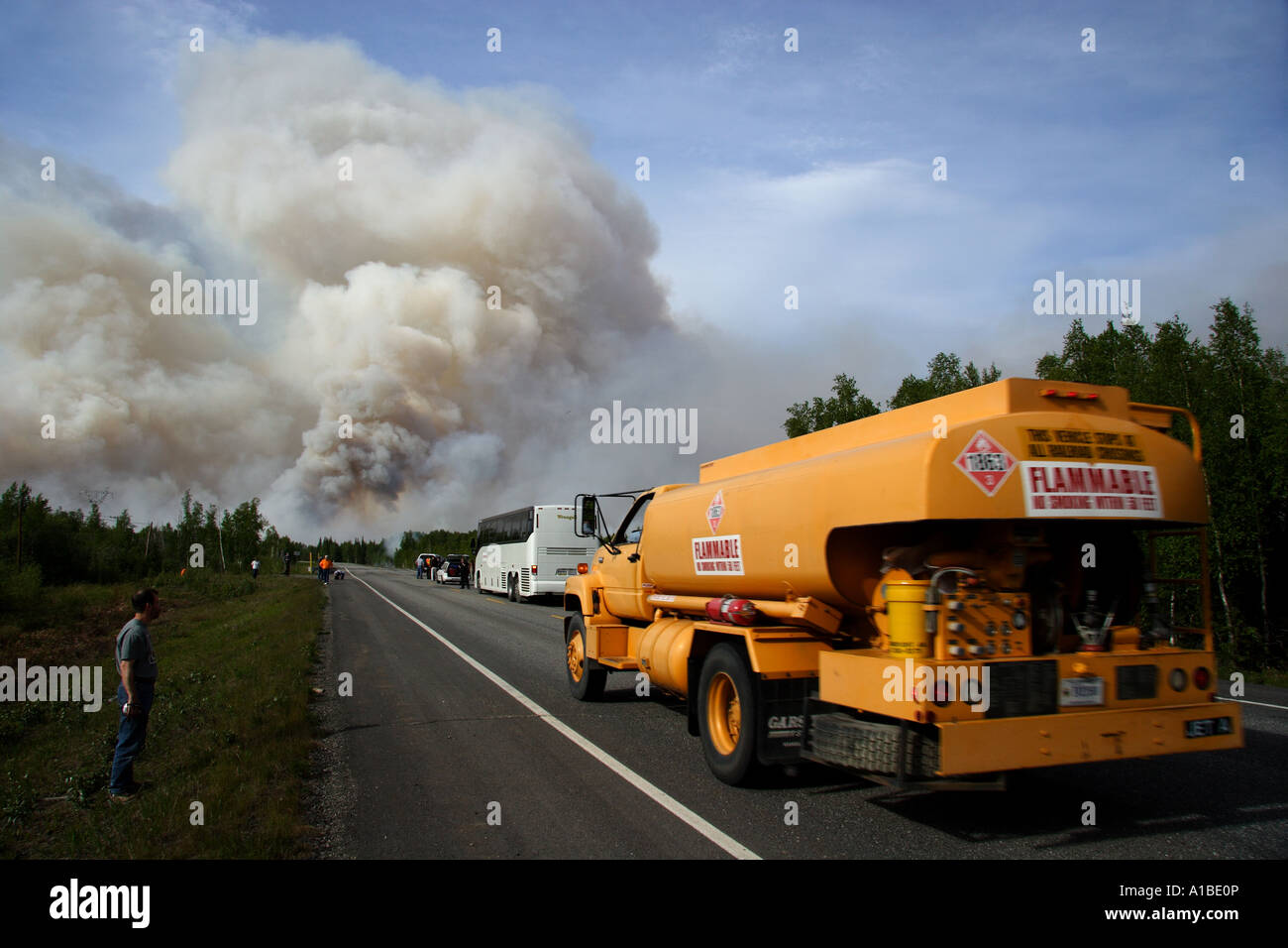 Fire fighters race toward a fire crossing the Parks Highway near Nenana ...