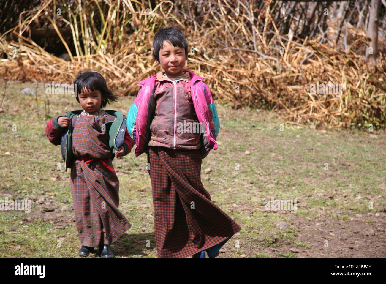 Two Bhutanese children living in a remote village high in the Himalayas ...