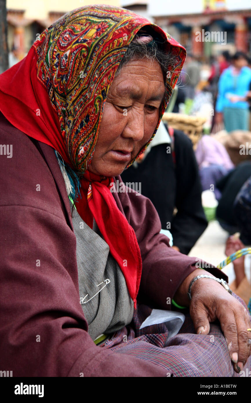 A Bhutanese woman sells vegetables at the weekly market in Paro, Bhutan ...