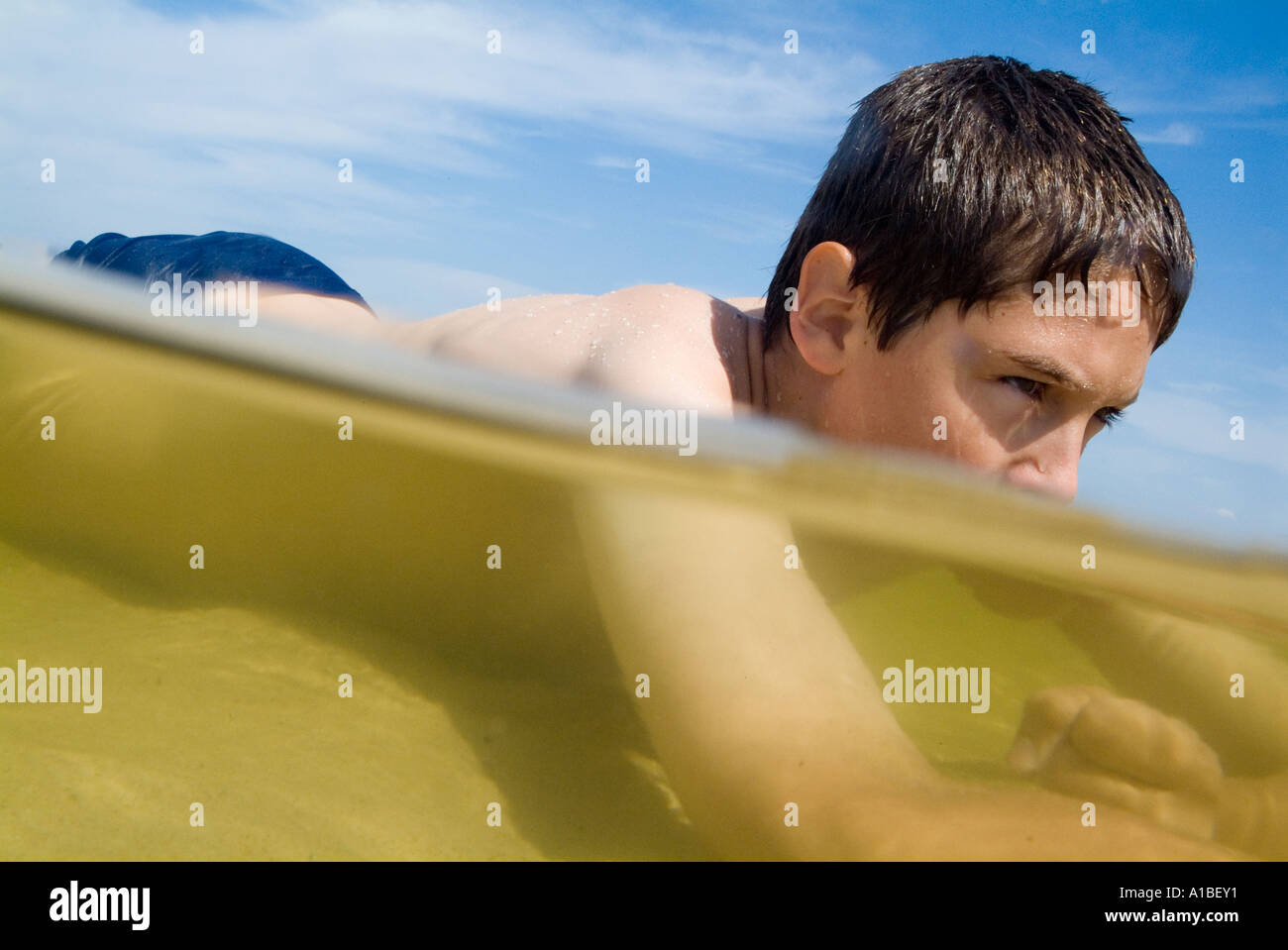 Boy in the sea Stock Photo - Alamy