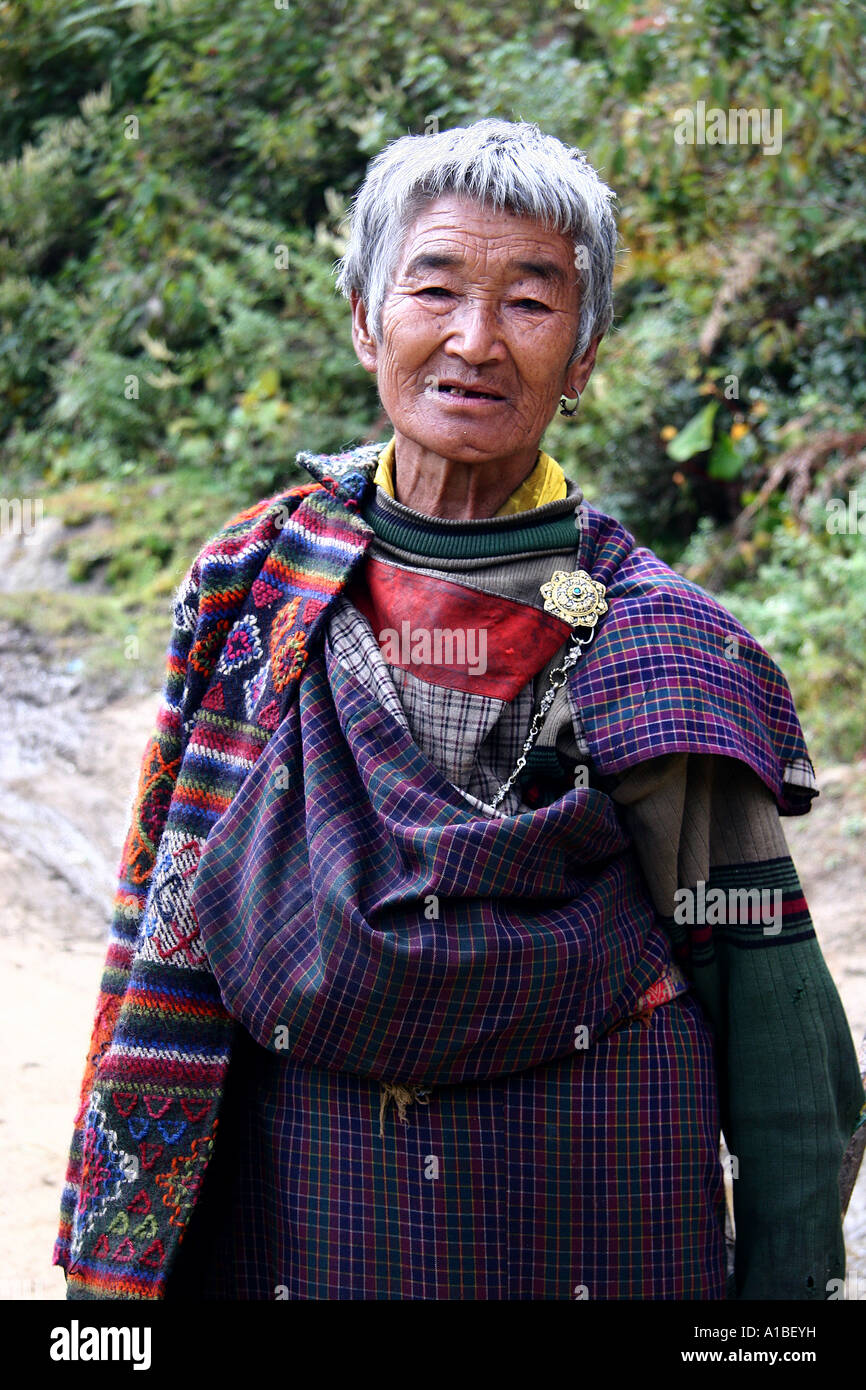 A Bhutanese woman dressed in a traditional kira, Paro Valley, Bhutan ...