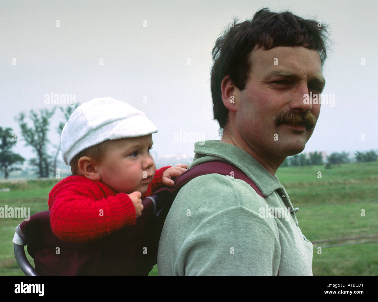 father with baby in carrier Stock Photo - Alamy