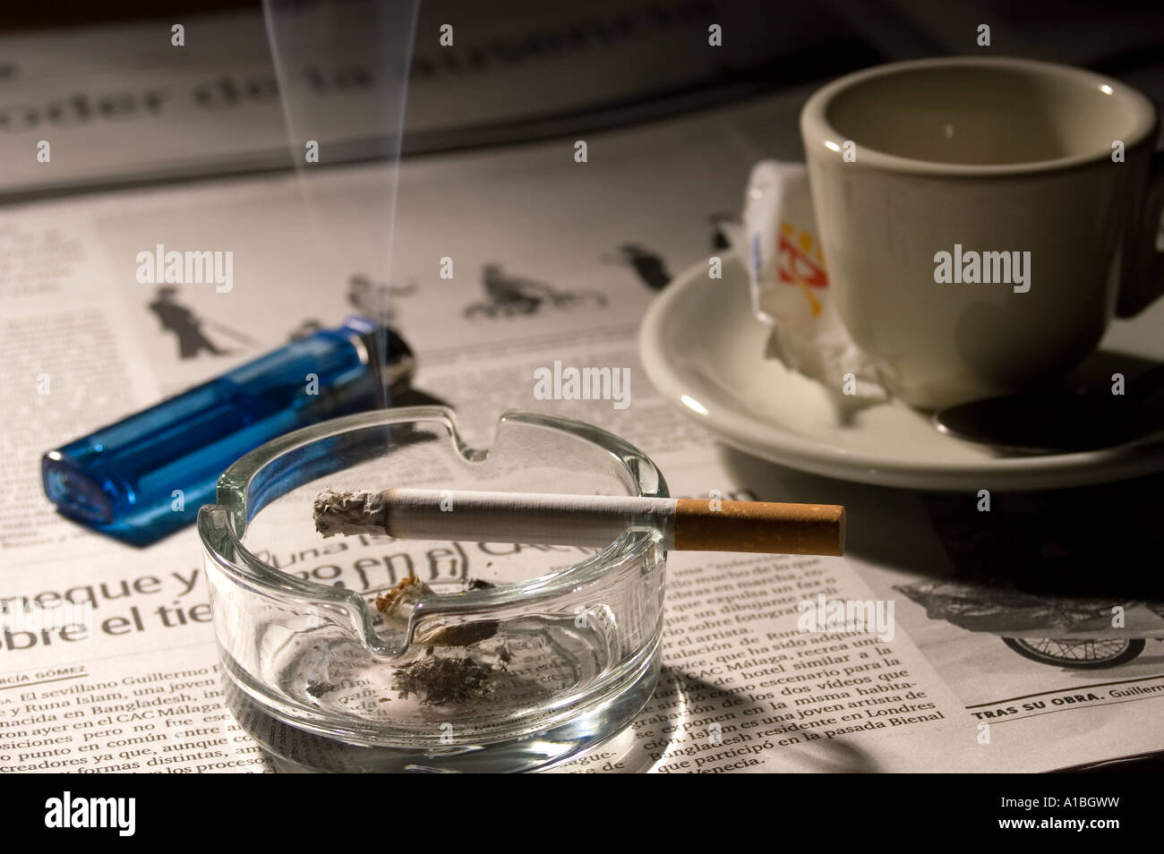 Still life about tobacco cigarette alite on an ashtray with lighter and ...