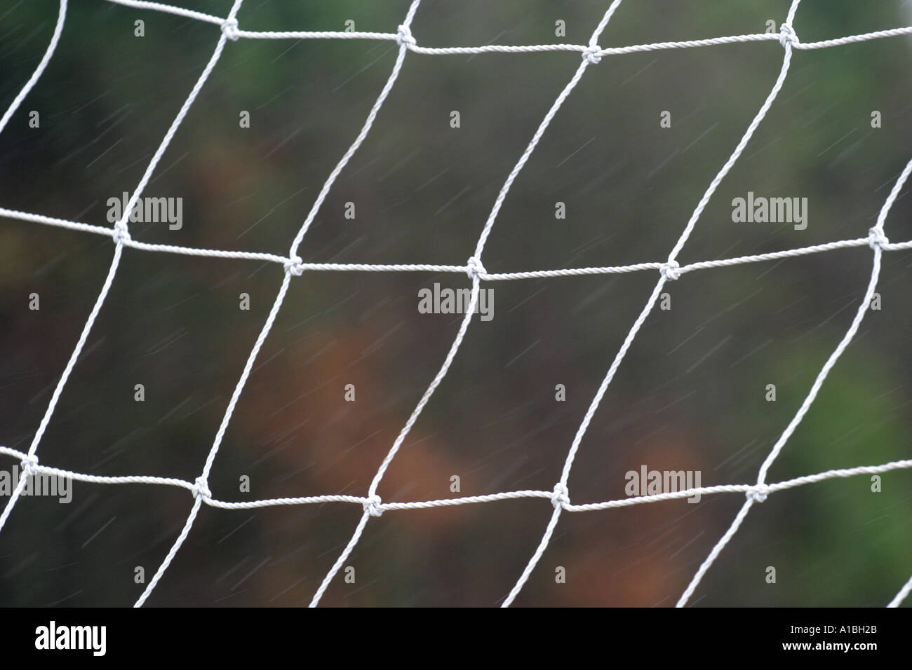 Football soccer GAA Gaelic Hurling goal net in the rain at park in ...