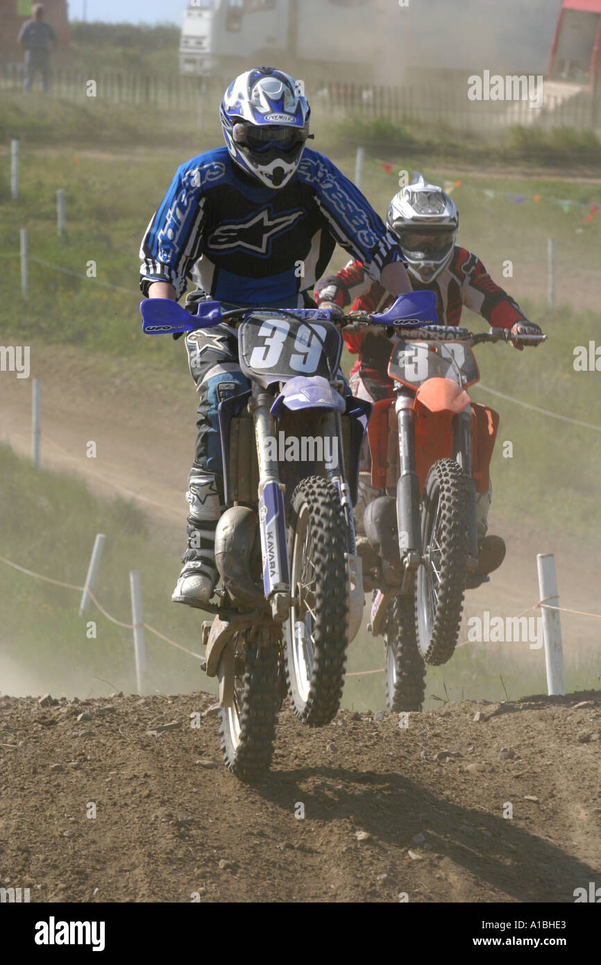 Motorbike jumping two riders hi-res stock photography and images - Alamy