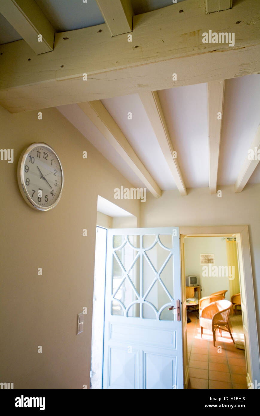 Doorway and clock inside a summer house Stock Photo - Alamy