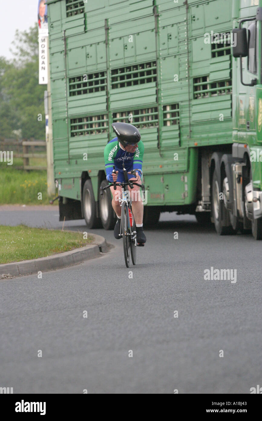 time trial cyclist looking at following lifestock transporter moira tt ...