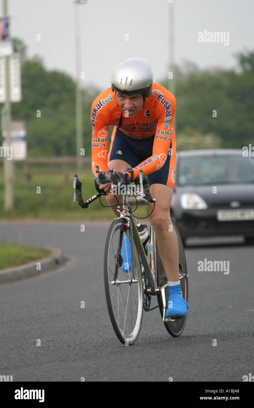 Time Trial cyclist being followed by car in the Moira TT at Nutts ...