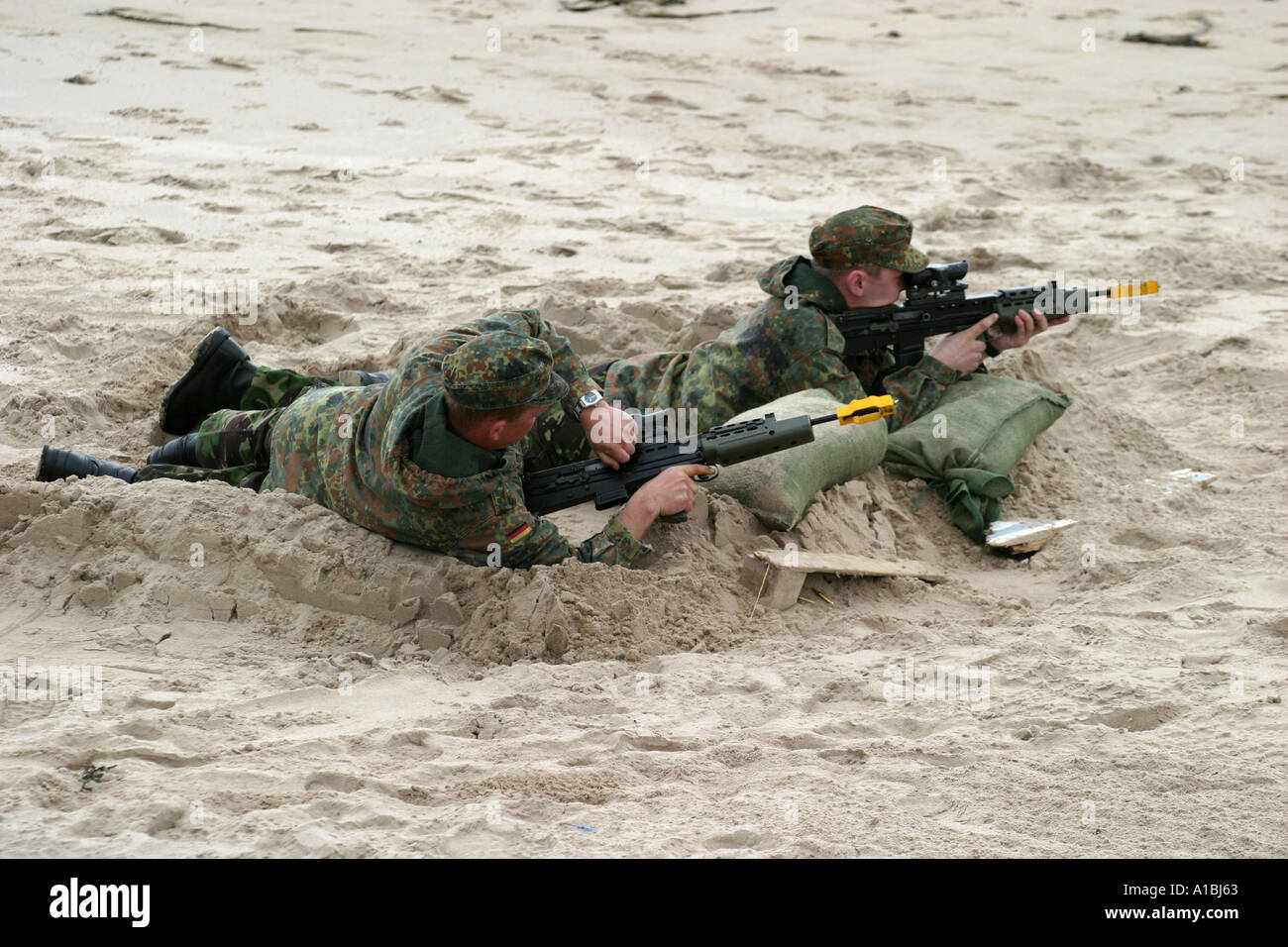 Royal Irish Regiment soldiers pose as aiming and rifle cocking enemy ...