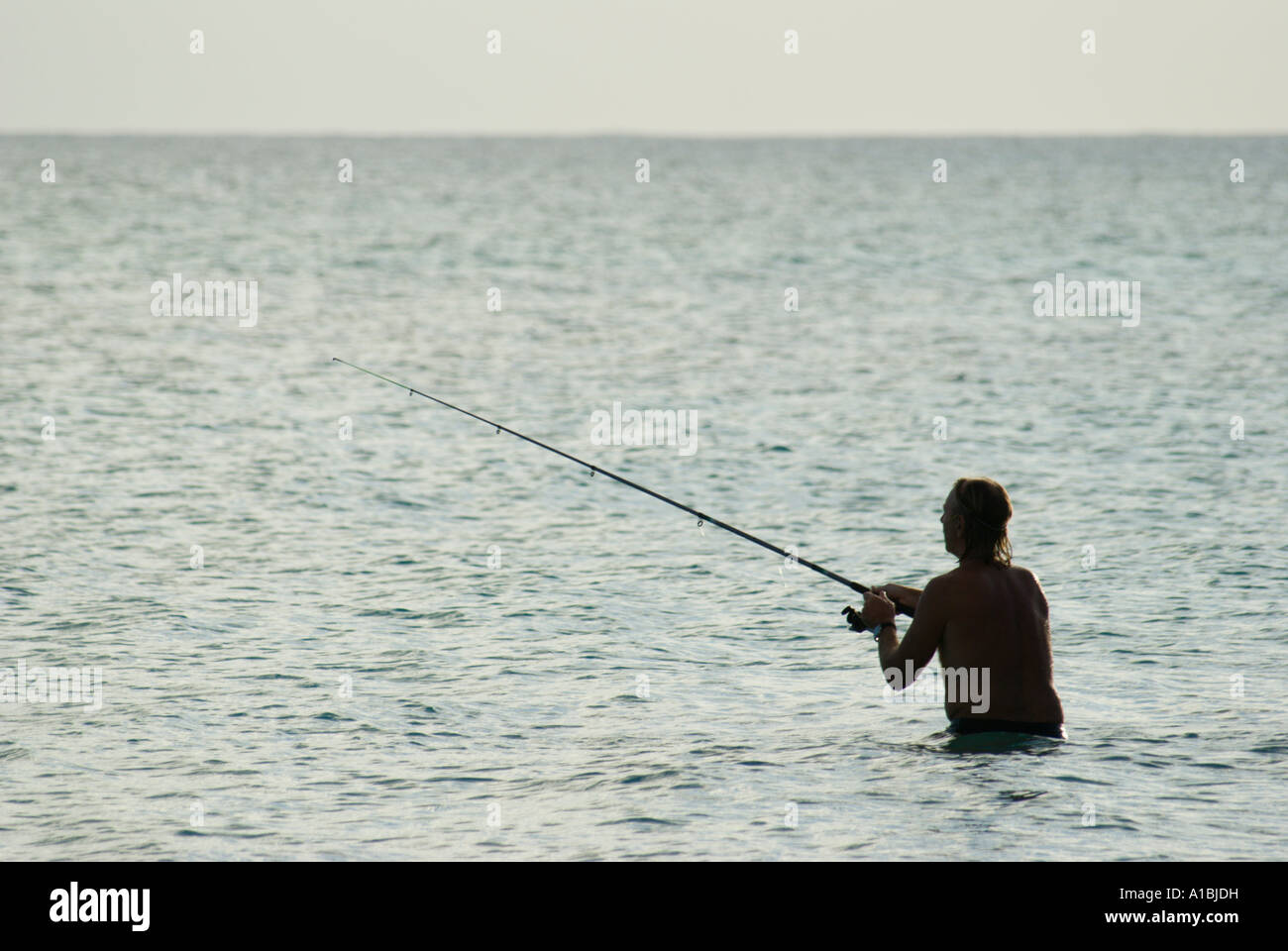 Barbados beach man caribbean fishing hi-res stock photography and ...