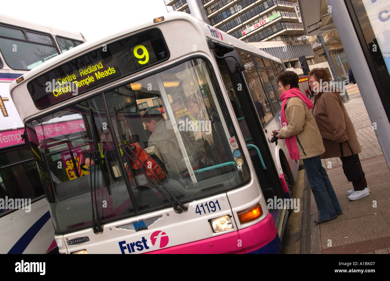 Bus picking up passengers at bus stop in Bristol city centre England UK ...