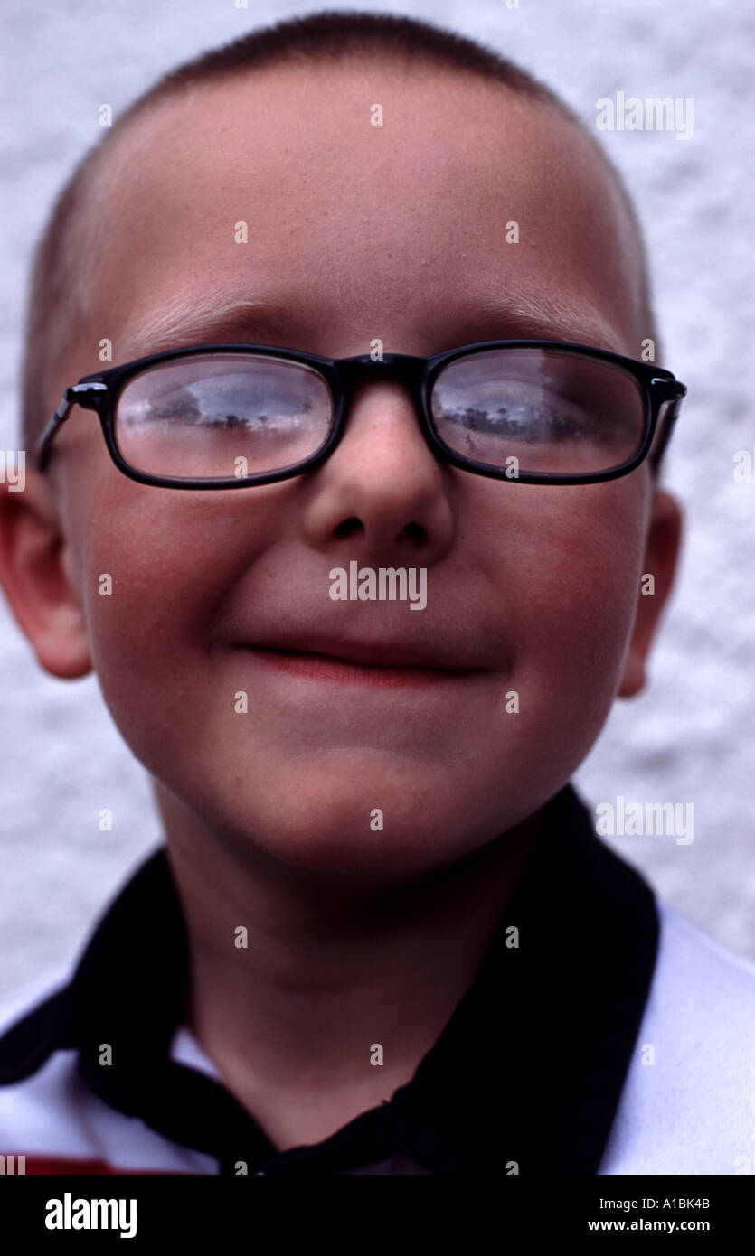 Young boy wearing glasses, Bawdsey, Suffolk, UK Stock Photo - Alamy