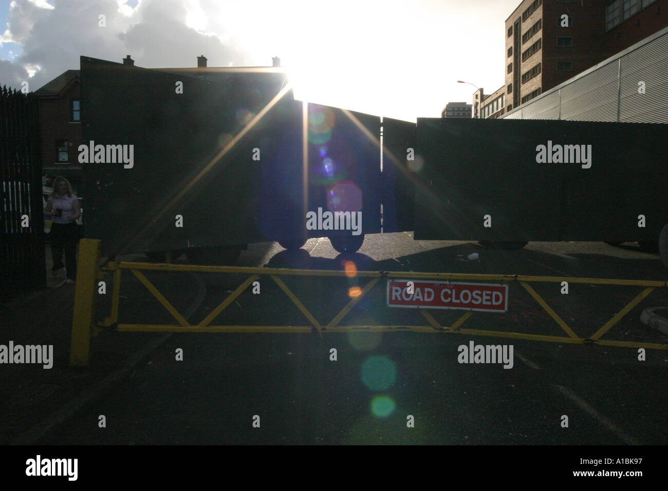 sunlight breaks over barrier at road closed sign at PSNI RUC British ...