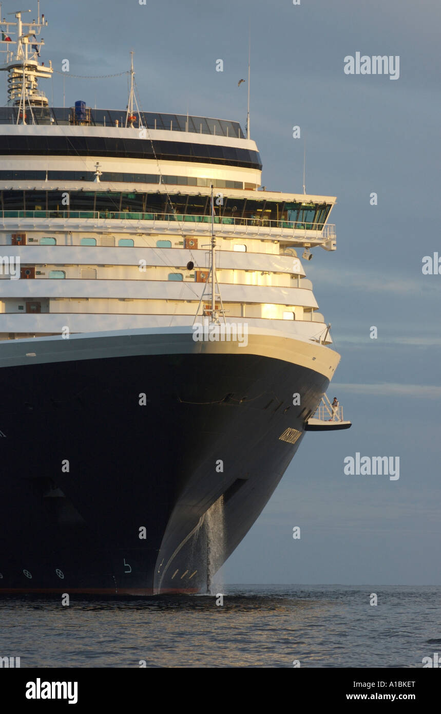 Cruise ship raising anchor with officer supervising from platform Cabo ...