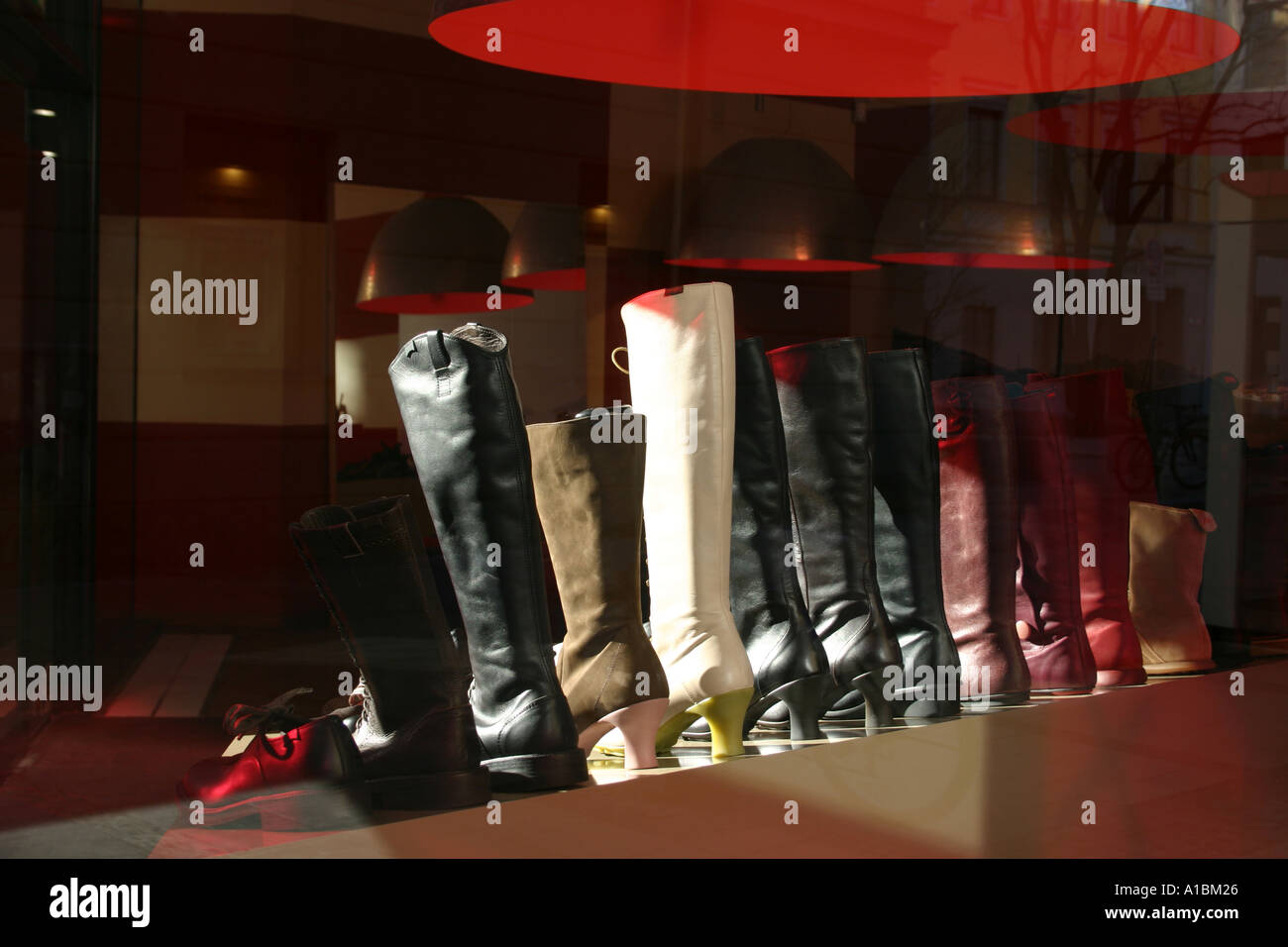 boots on display lined up in shop window Stock Photo - Alamy