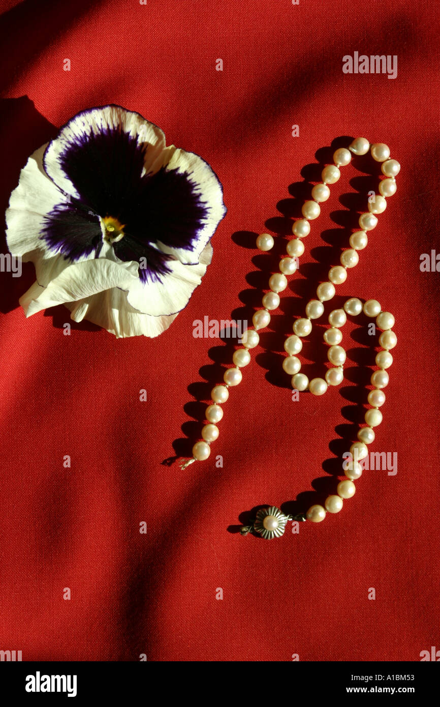 String of beads on white surface hi-res stock photography and images ...