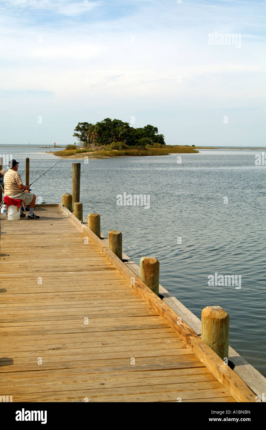 Fishing from a boardwalk on Withlacoochee Bay in the Gulf of Mexico ...