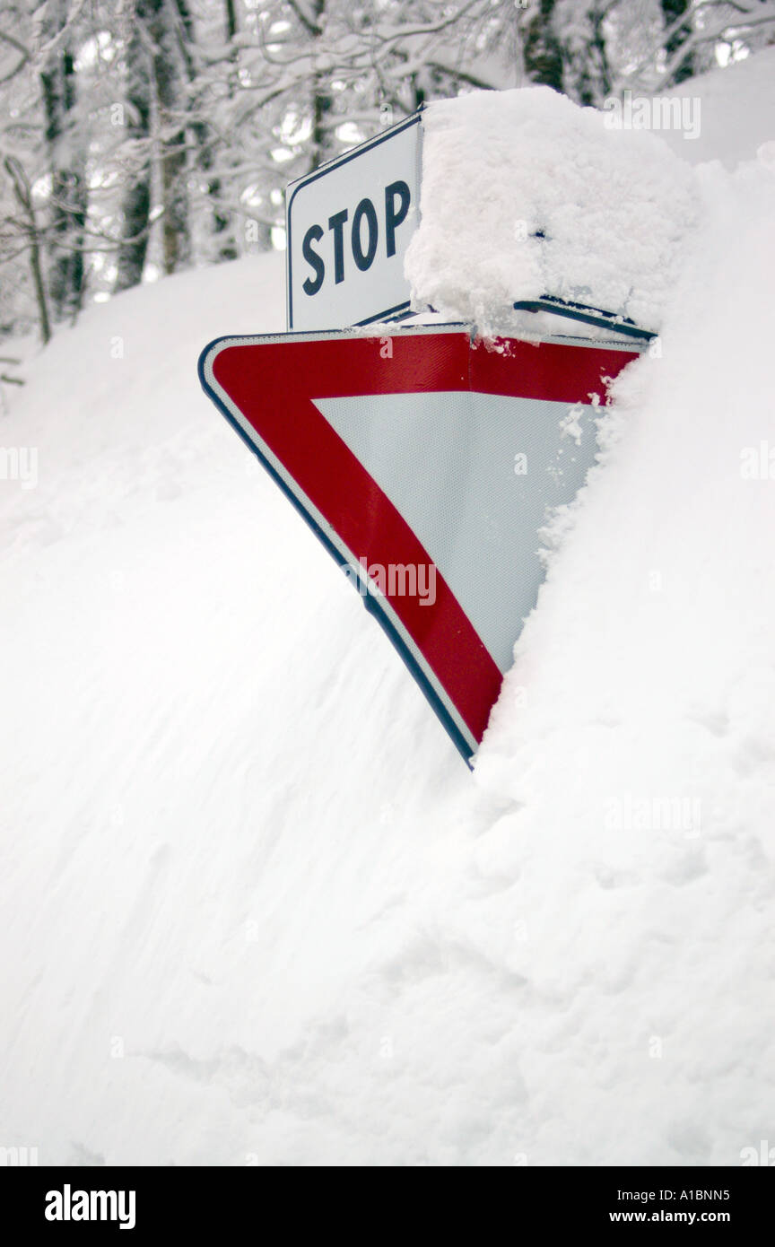 triangle road sign snow covered Stock Photo - Alamy
