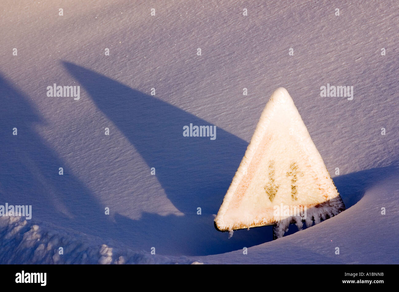 road signs with arrows snow covered Stock Photo - Alamy