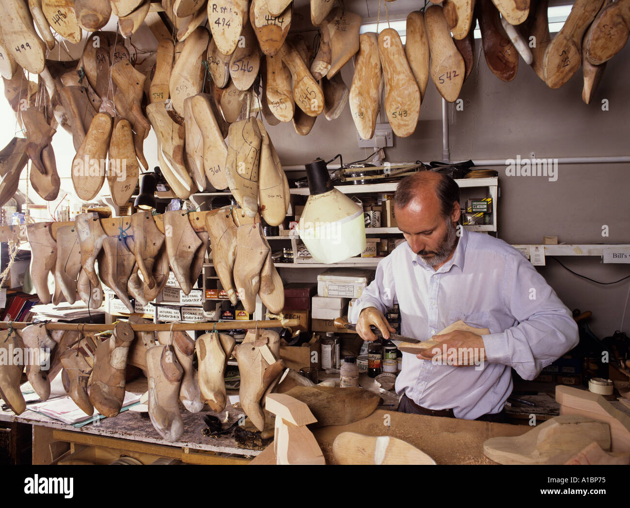 Making lasts for riding boots Stock Photo - Alamy