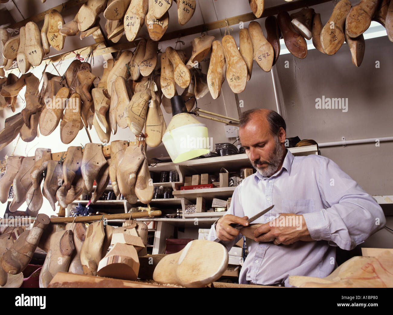 Making lasts for riding boots Stock Photo - Alamy