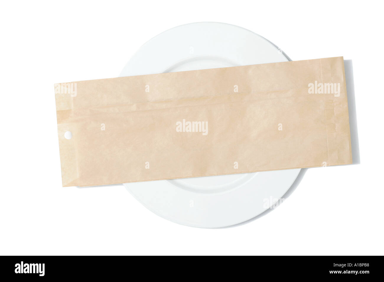 Empty paper bag on plate Stock Photo - Alamy