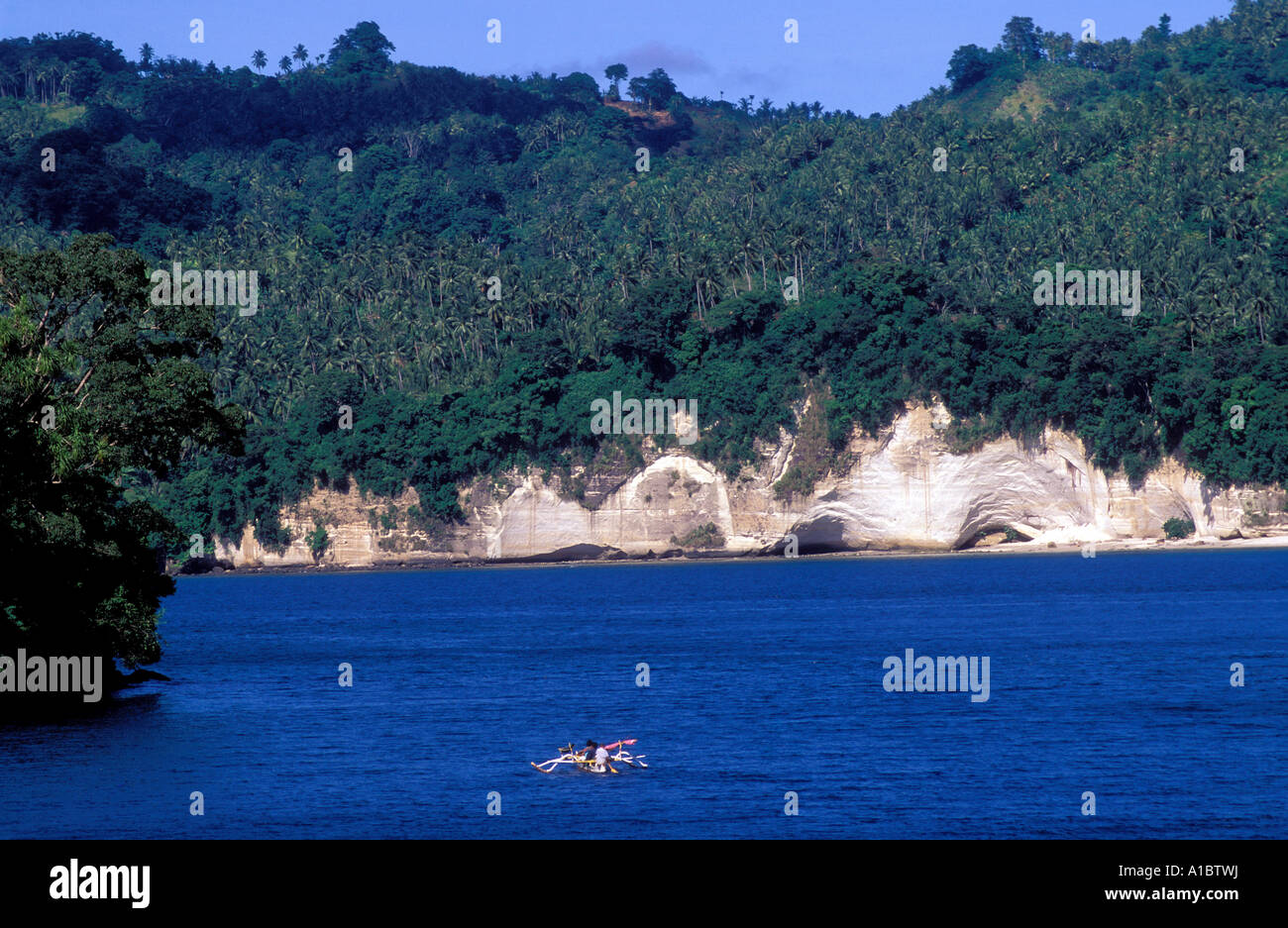 Scenic view of Lembeh Strait with limestone cliff of Lembeh Island ...