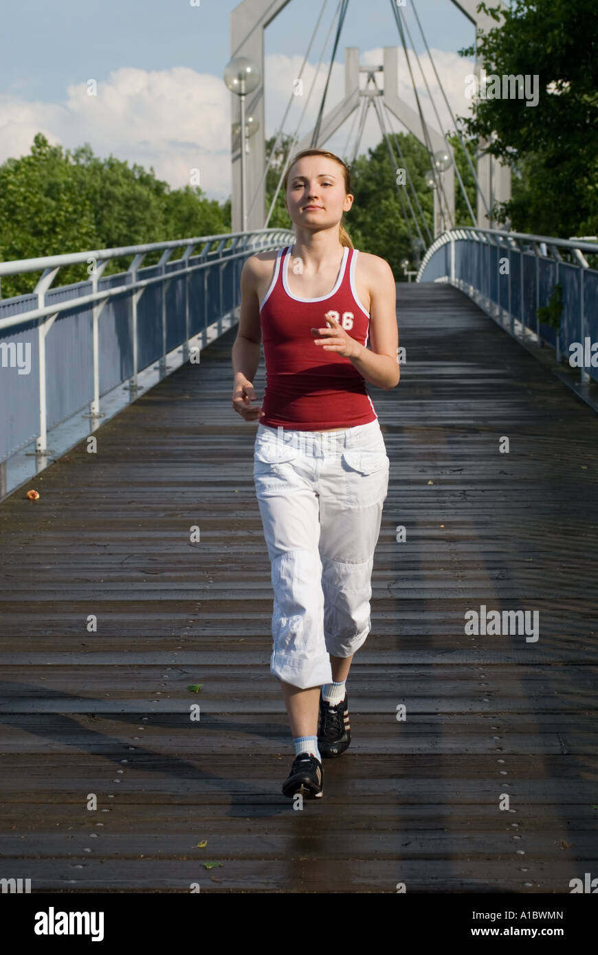 young beautiful woman jogging Stock Photo - Alamy