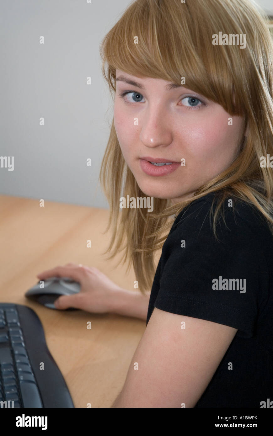 young woman works with computer Stock Photo - Alamy